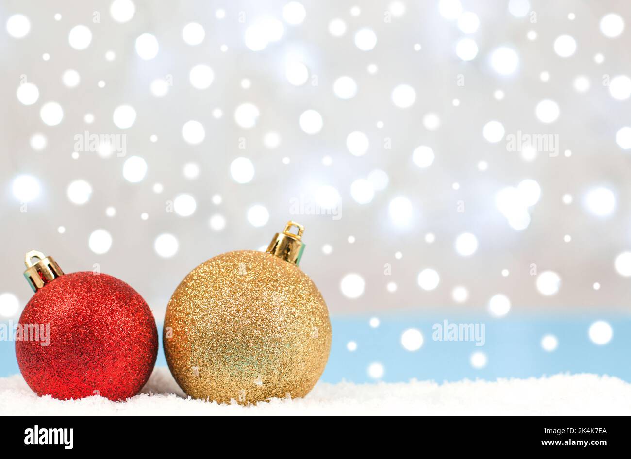 Christmas balls on the background of blurry lights of garlands ...