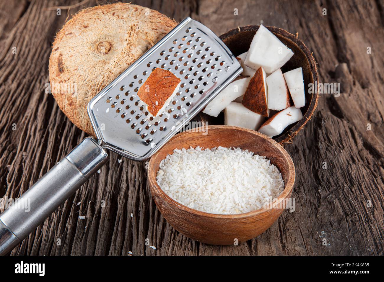 Coconut halves, coconut pieces on wooden background top view ...