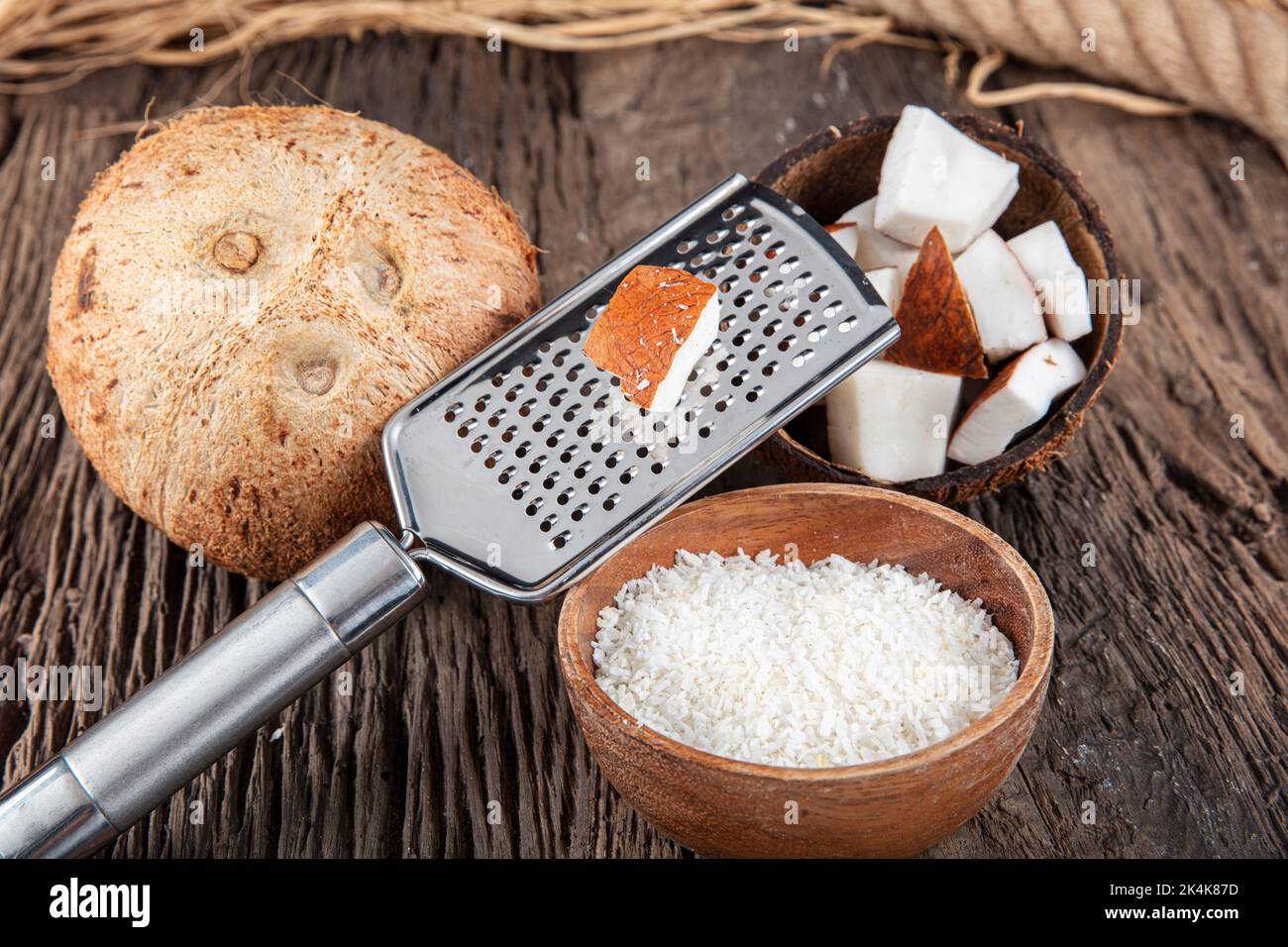 Coconut halves, coconut pieces on wooden background top view ...