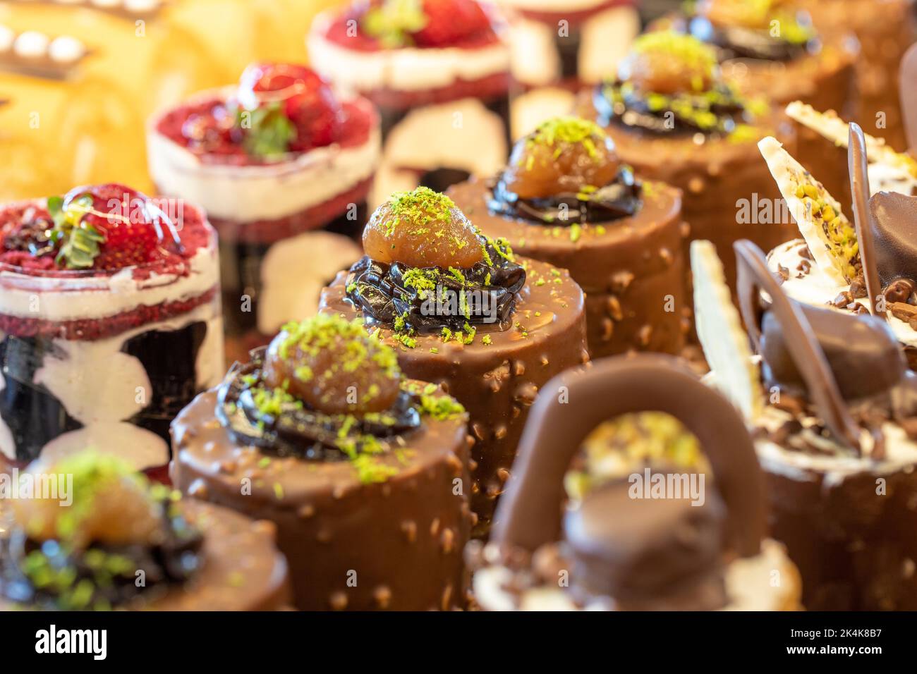 Types of cakes. Cakes on display at the patisserie counter Stock Photo ...
