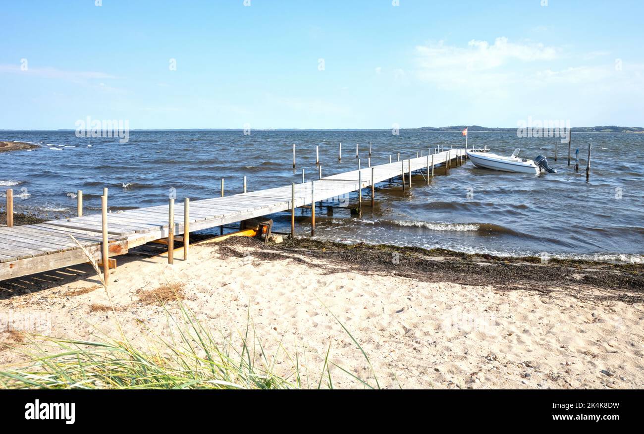 Seascape tranquil background with room for text, broken jetty in the ...