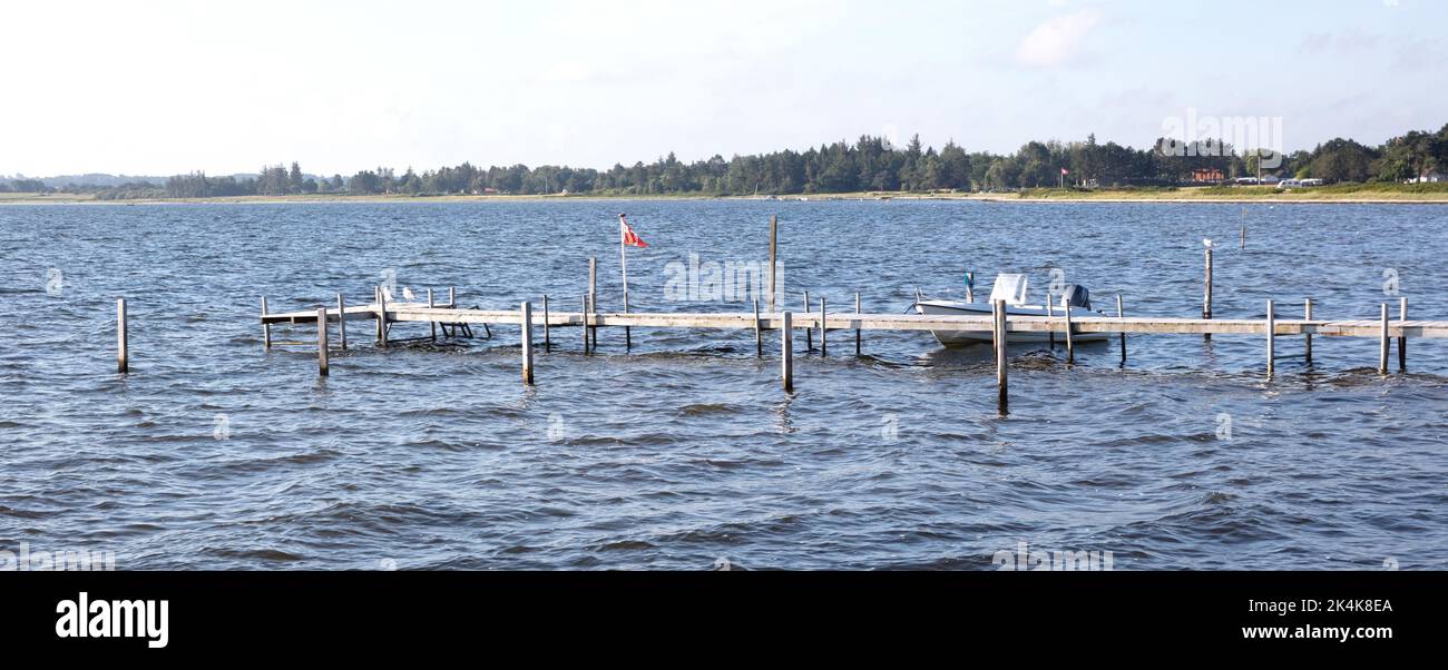 Seascape tranquil background with room for text, broken jetty in the ...