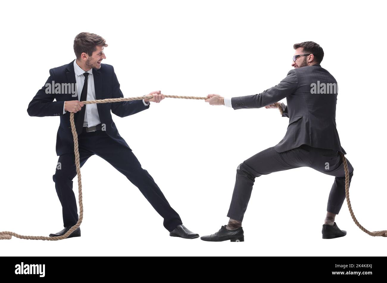 full length . two smiling businessmen pulling the rope Stock Photo - Alamy