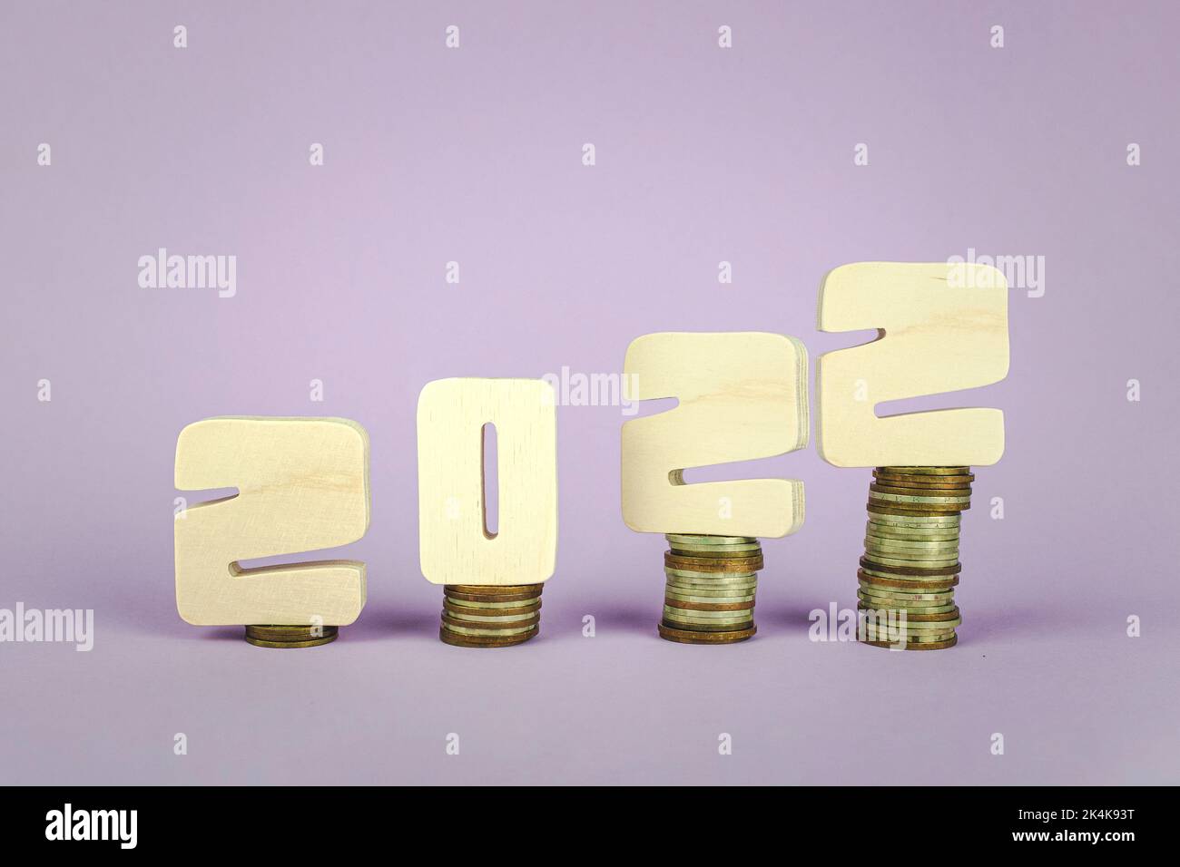 Golden Coins stack arranged as a graph with 2022 year on magenta ...