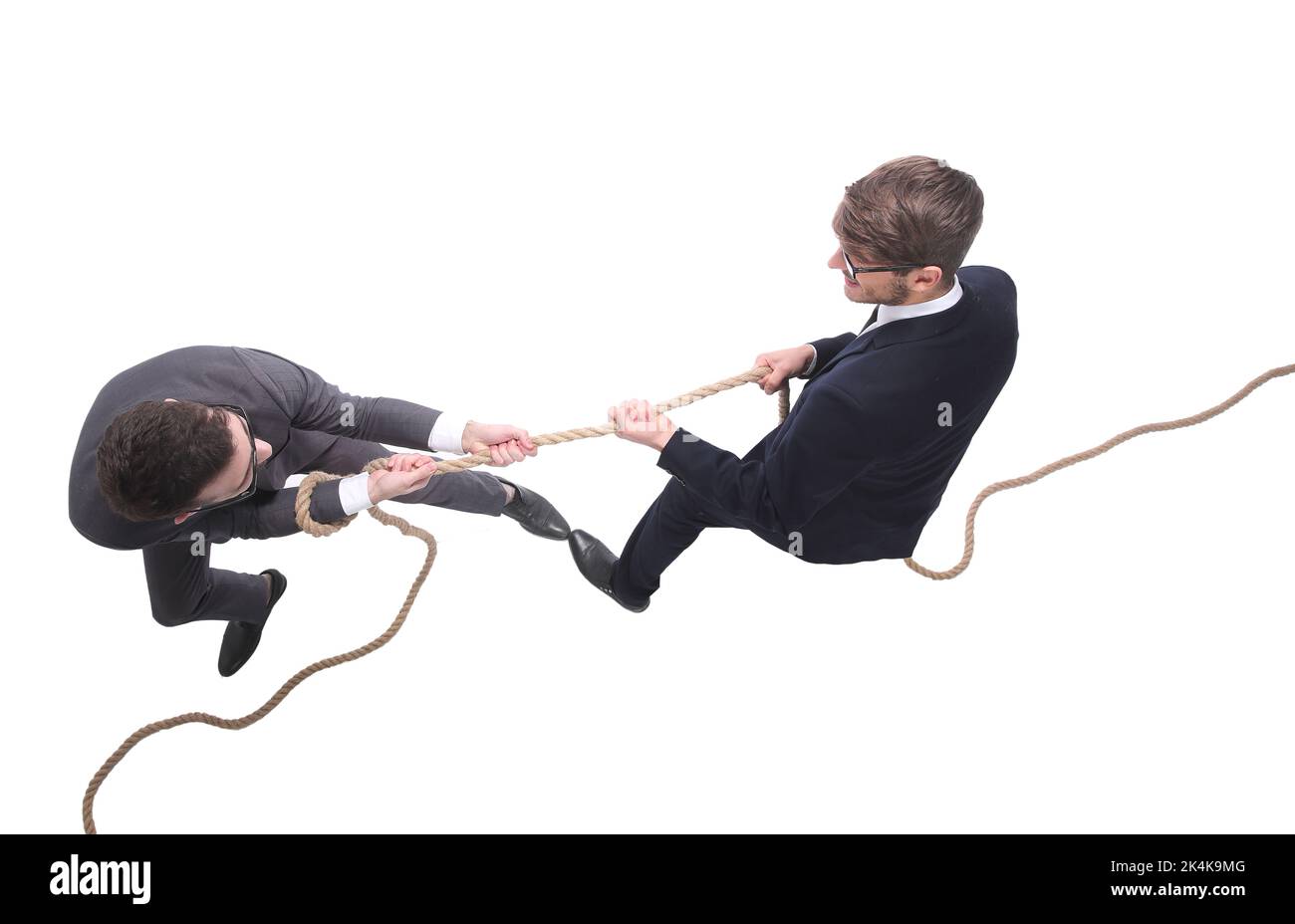top view. two young businessmen pulling the rope Stock Photo - Alamy