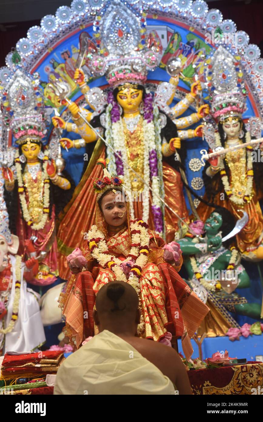Kolkata, India. 02nd Oct, 2022. Hindu holy men carry a Kumari or virgin goddess during the Durga ...