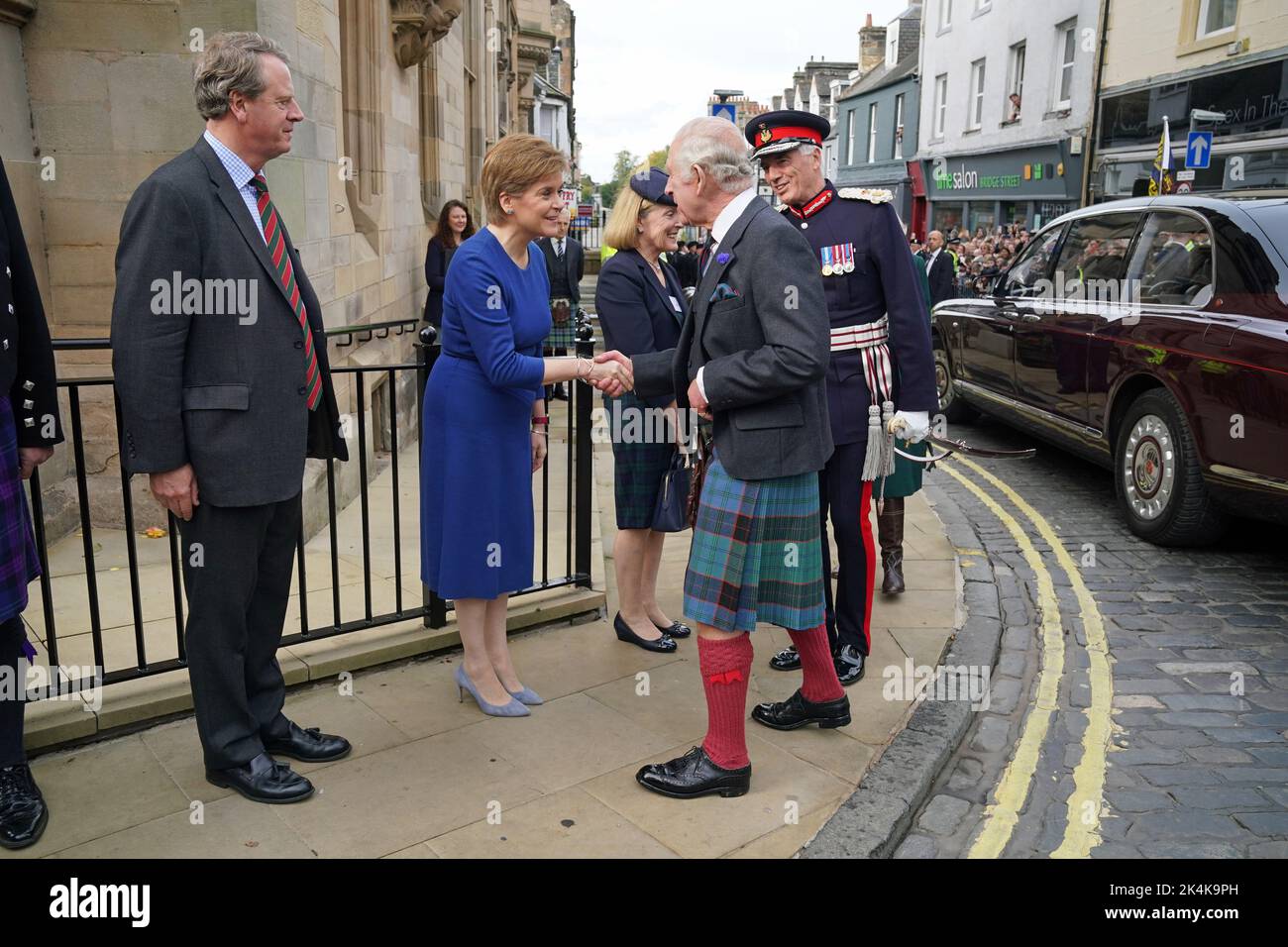 King Charles III shakes hands with First Minister Nicola Sturgeon as ...
