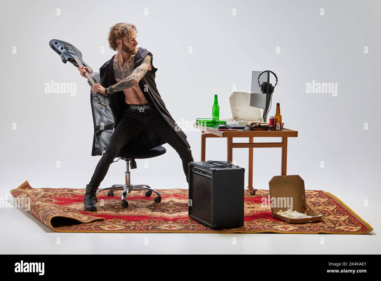 Stylish man, rock musician expressing negative emotions, smashes ...