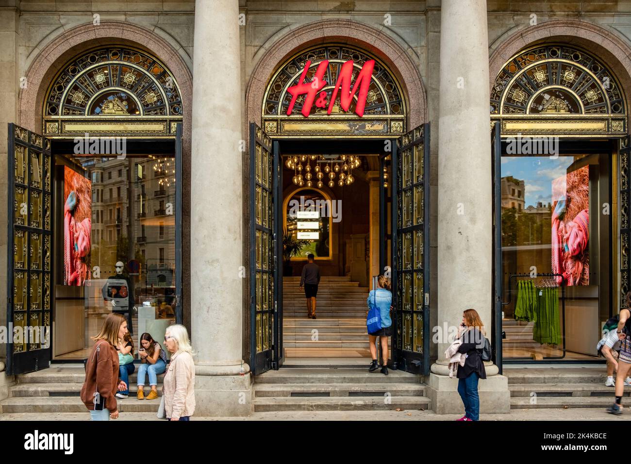 The logo of the fast fashion clothing brand H&M is seen on top of store ...