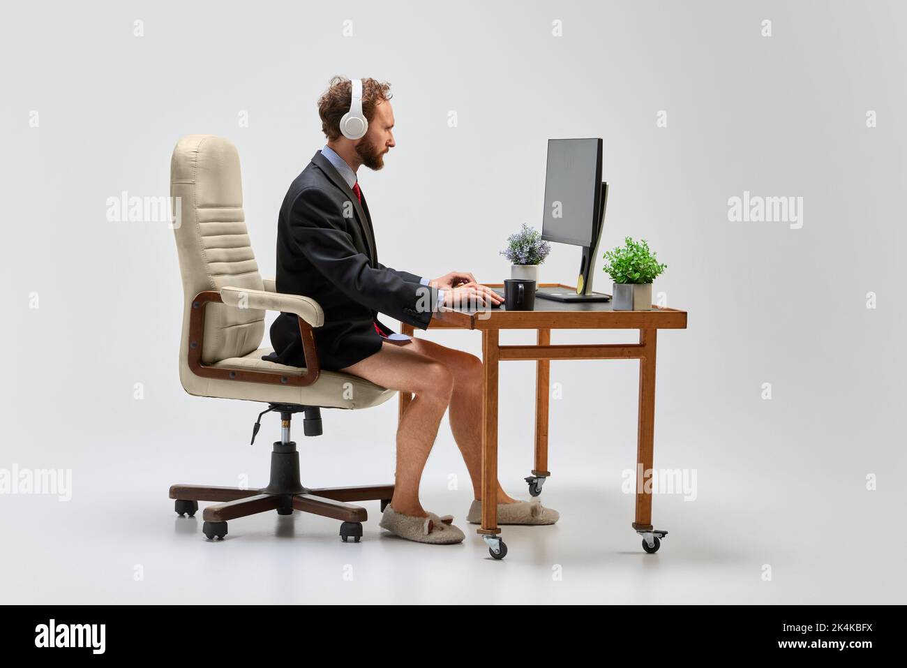 Meeting. Young business man sitting at home and taking part at online ...