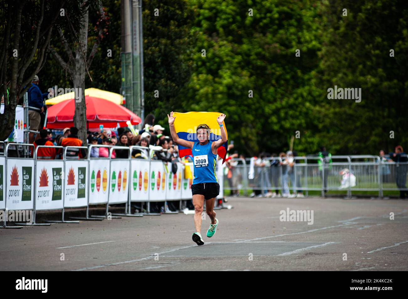 Miguel del Valle a Venezuelan athlete finishes the race carrying a ...