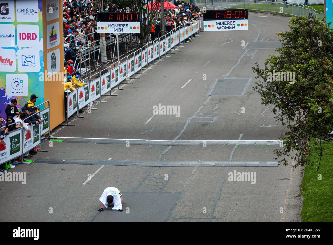 Colombian runner Franklin Tellez finishes the 21k race during the ...
