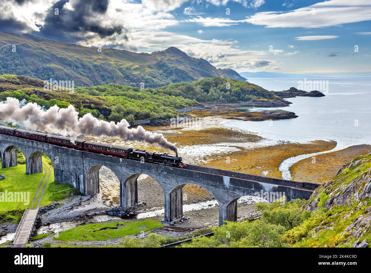 JACOBITE STEAM TRAIN LONG PLUME OF DARK SMOKE FROM THE ENGINE AS IT ...