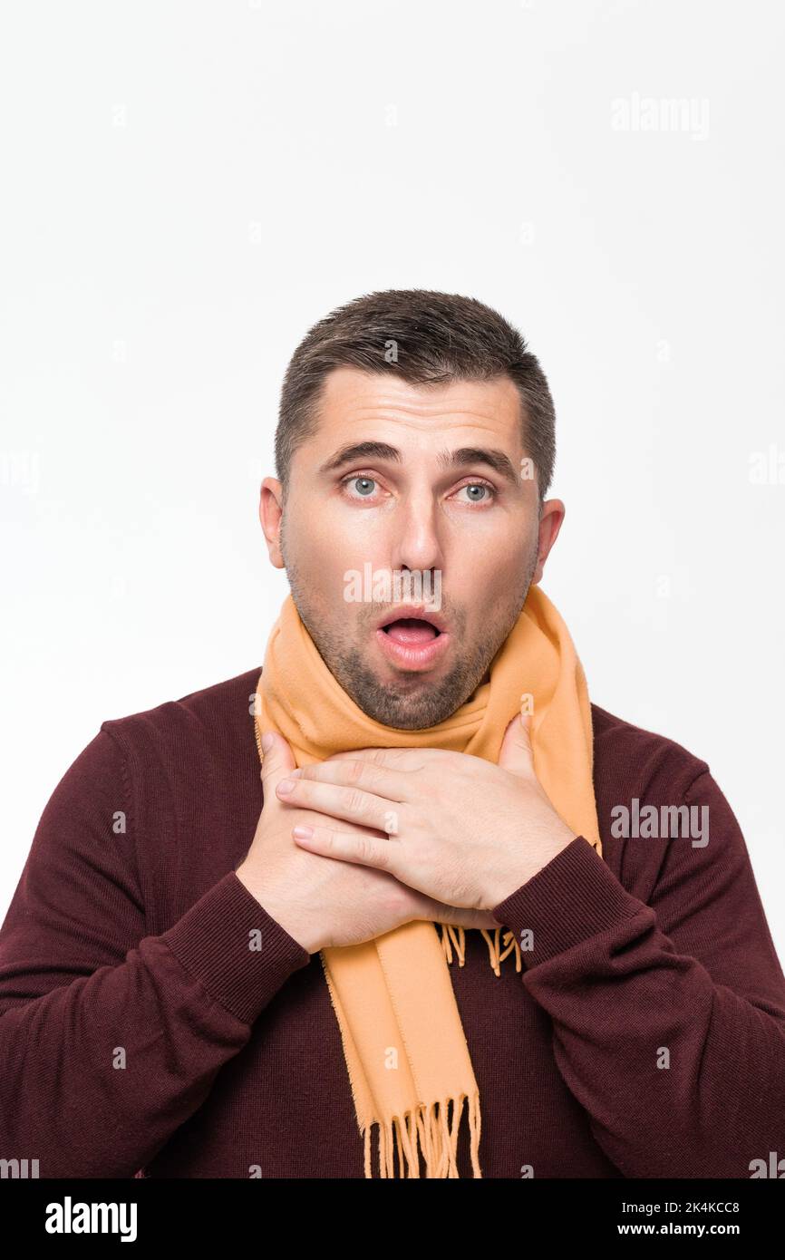 A man suffers from a sore throat, a man wrapped his throat with a scarf ...