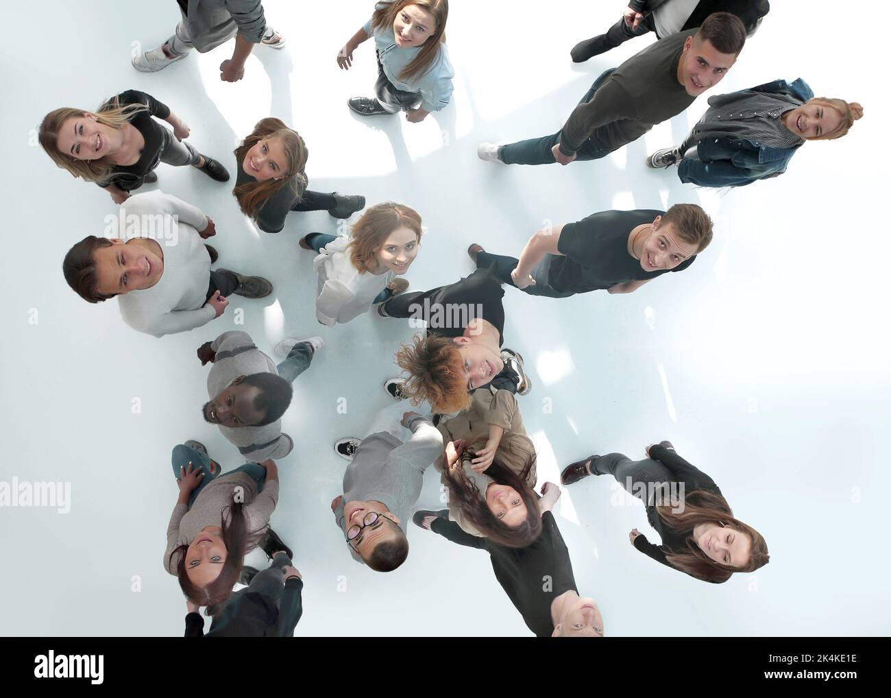 top view .groups of diverse young people moving towards each other ...