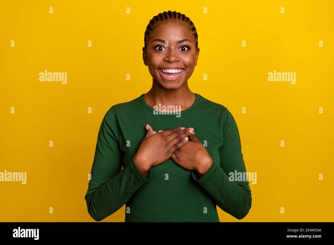 Photo of funny excited young woman wear green shirt arms chest smiling ...