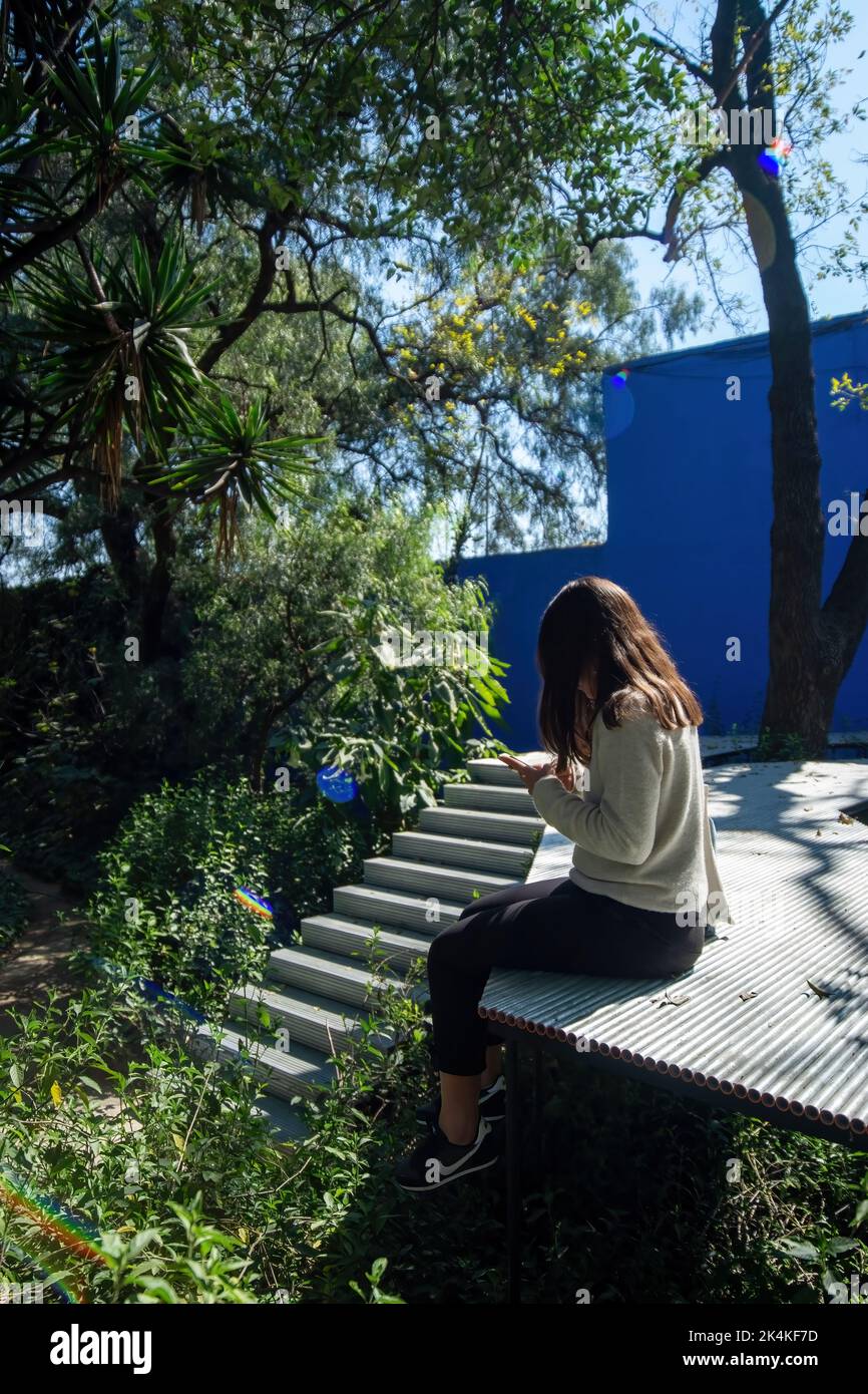 happy old man, sitting waiting, sitting on steps while drinking a cola ...