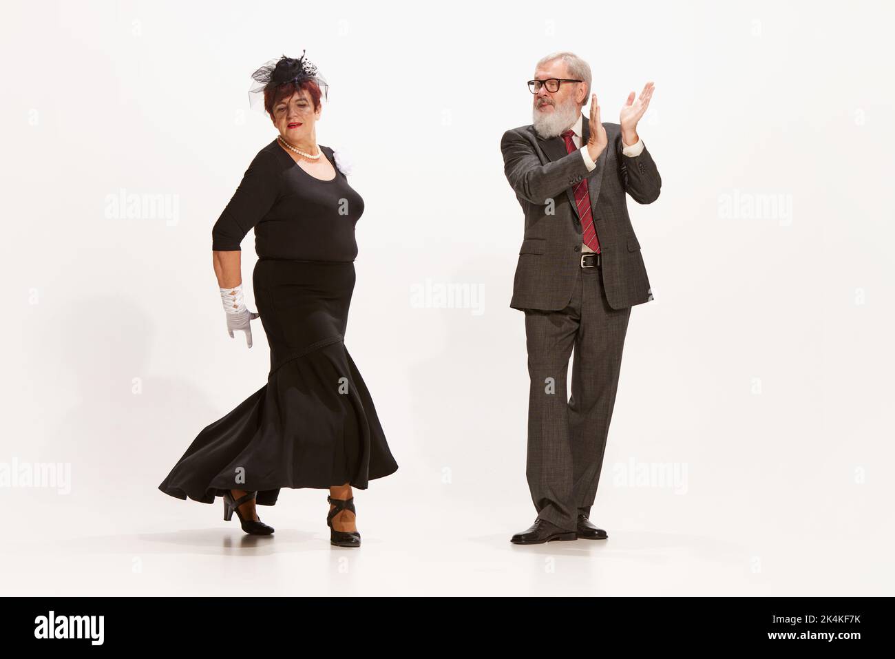 Tango. Handsome senior man and adorable middle age woman in vintage ...