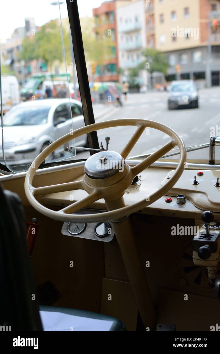 A vertical closeup of the steering wheel of an old bus Stock Photo - Alamy