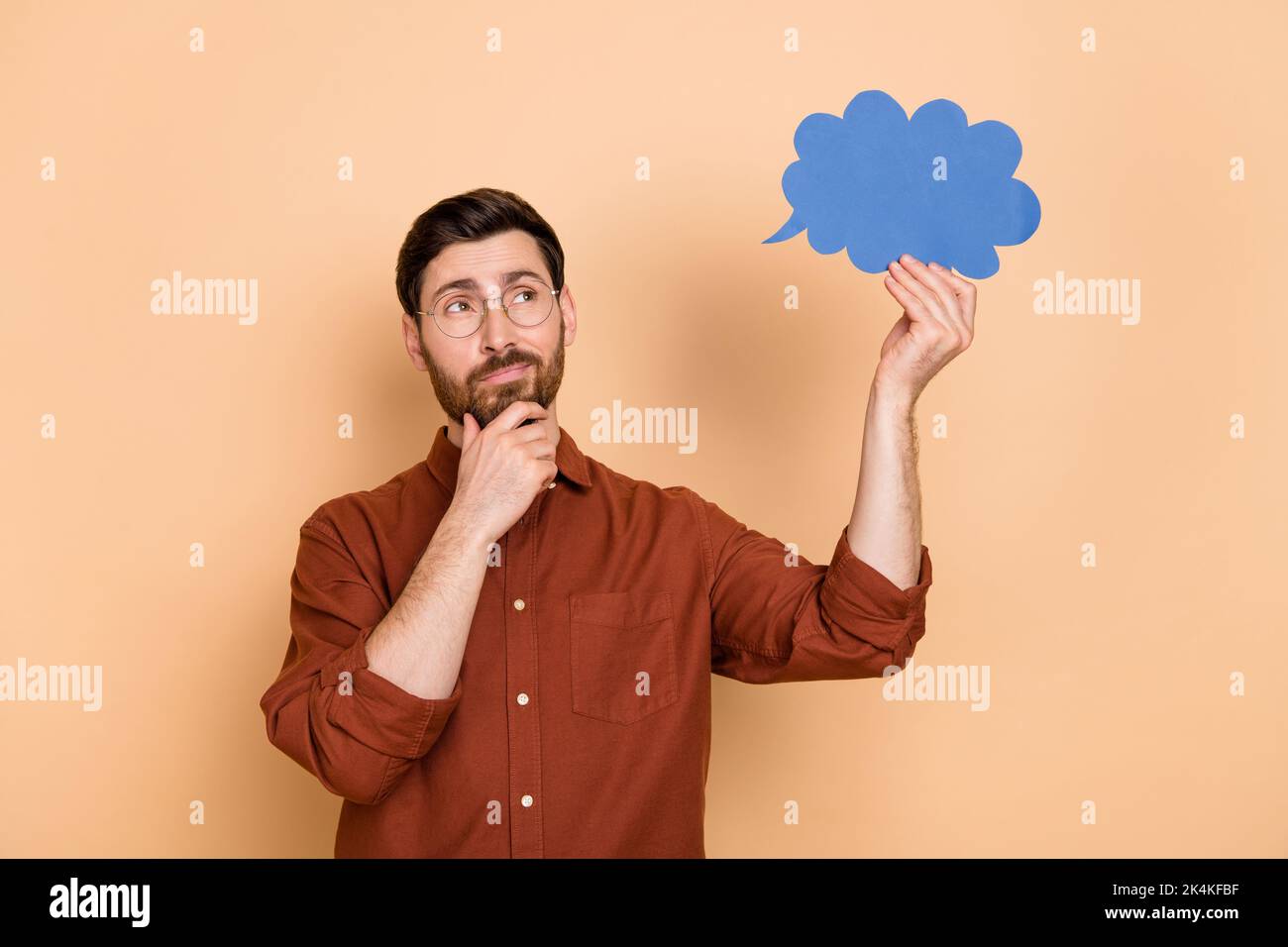 Portrait of minded clever man arm touch chin look empty space hold ...