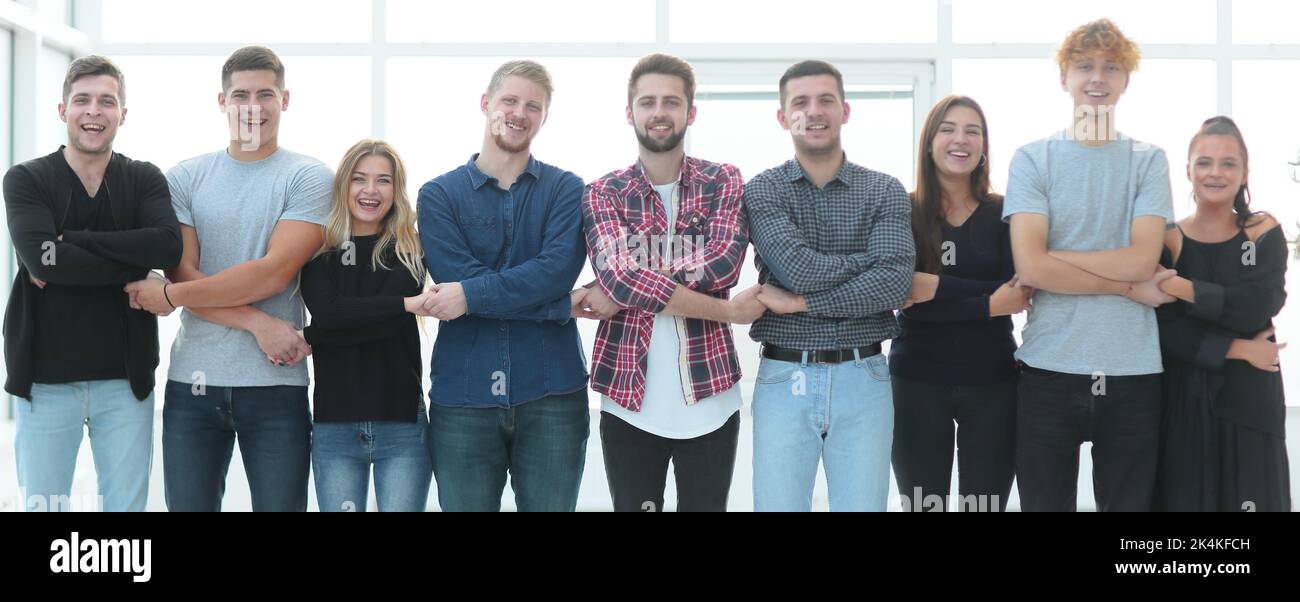 group of happy young employees standing together Stock Photo - Alamy