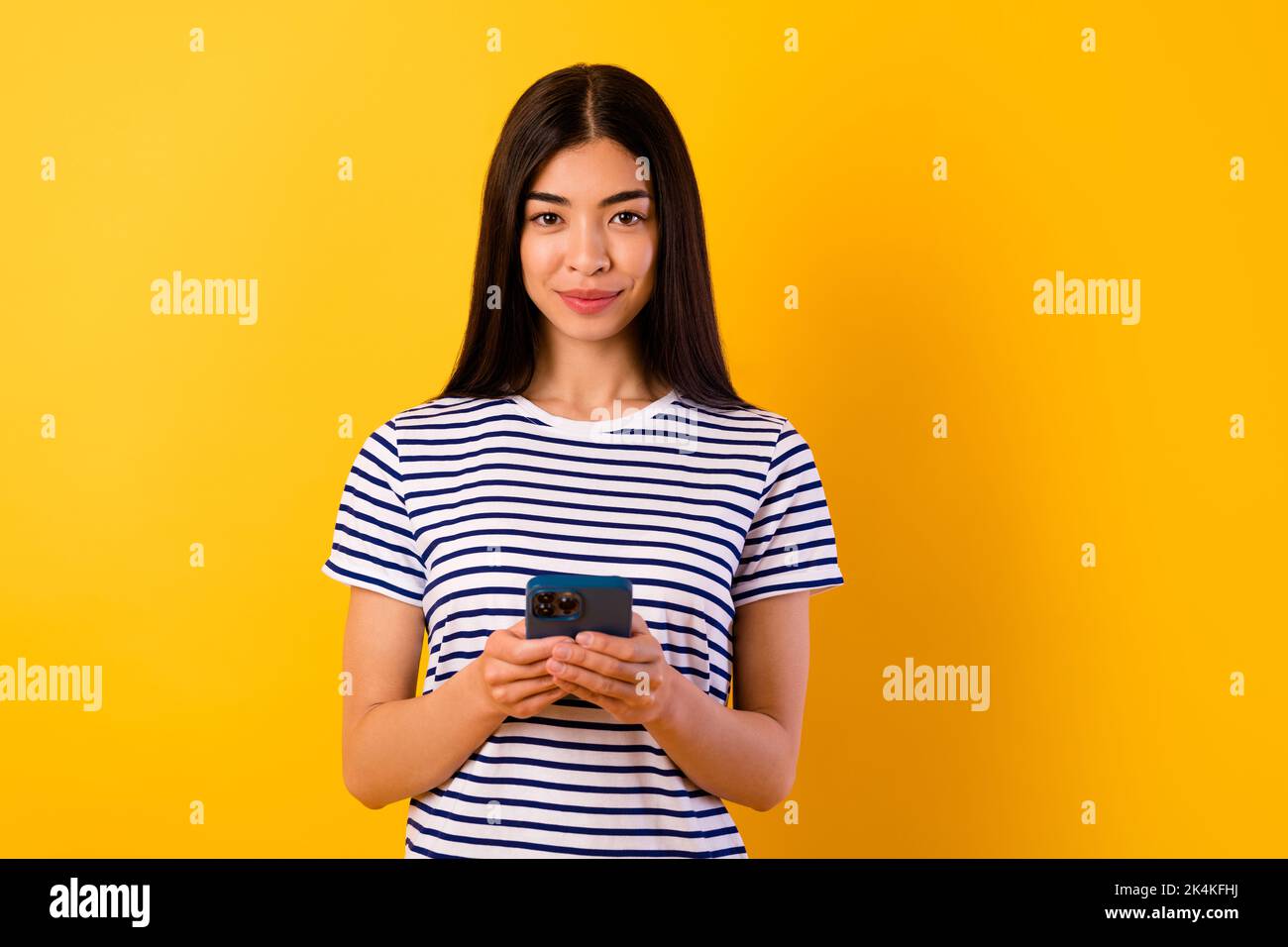 Photo of adorable nice filipino girl hands hold telephone typing post ...
