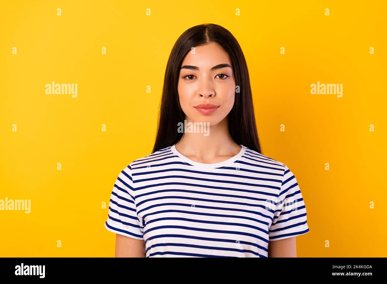 Portrait of nice satisfied calm young person wear white blue striped t ...