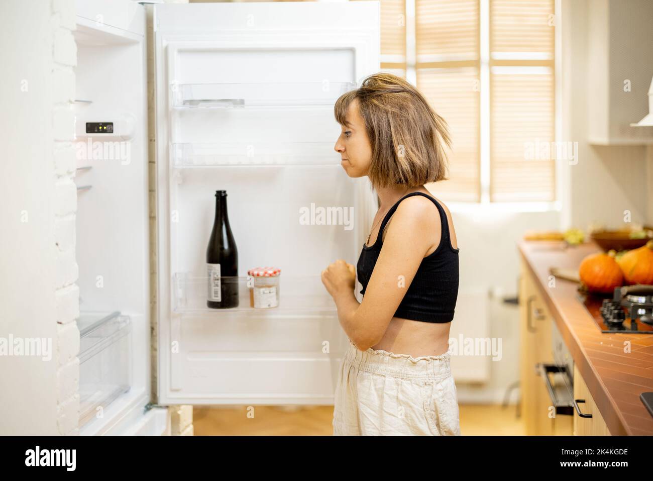 Empty fridge woman hi-res stock photography and images - Alamy