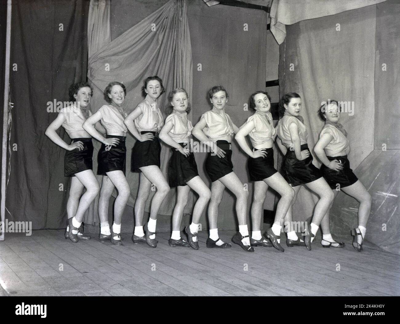 1955, historical, a group of girls in costumes on stage in a ...
