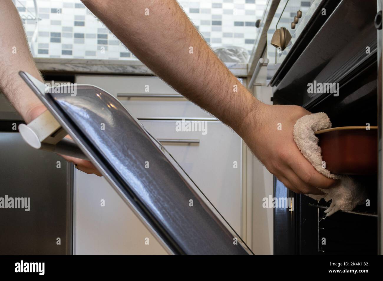 Cook in kitchen putting hi-res stock photography and images - Alamy
