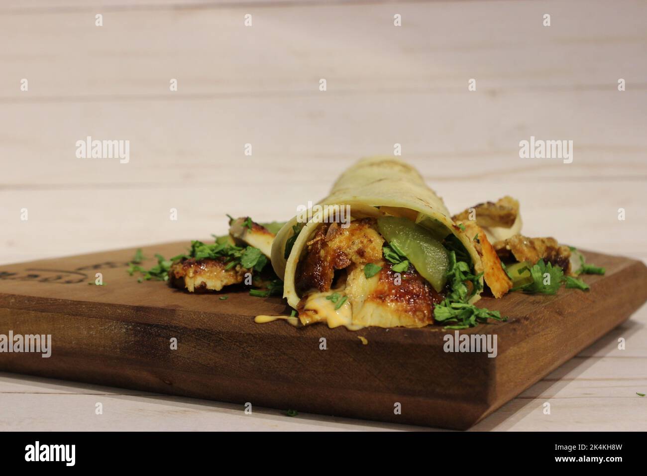 Large shawarma sandwich with sauces and pickles Stock Photo - Alamy