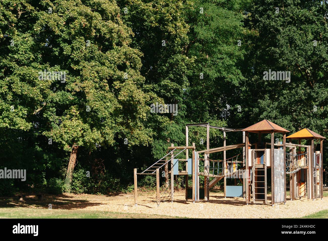Children's wooden playground recreation area at public park. Children's ...