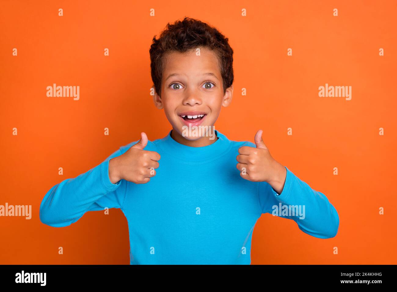 Close up photo of cheerful positive boy two arm demonstrate symbol ...