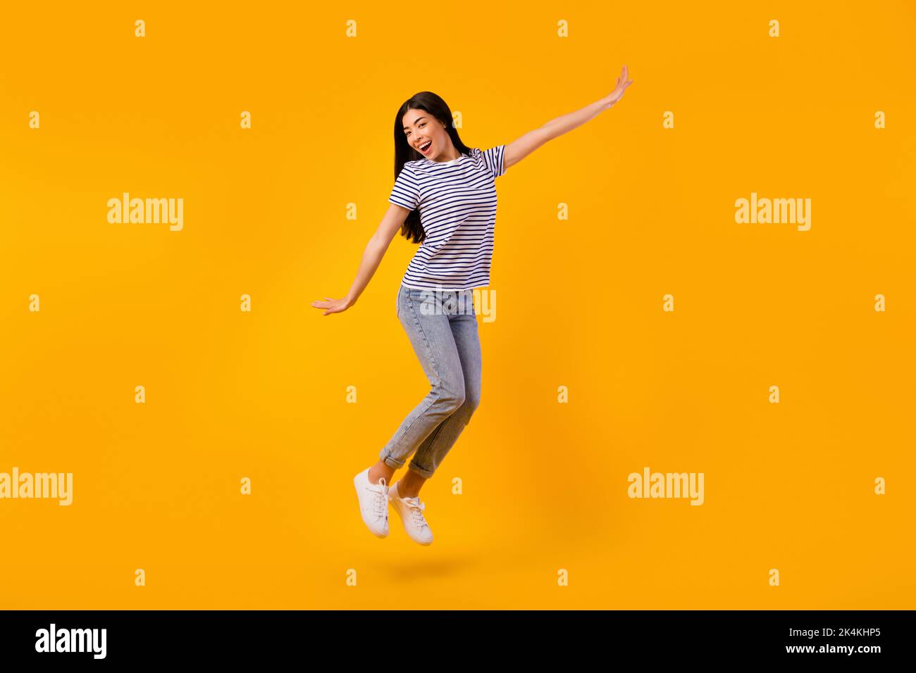Full body portrait of cheerful pretty person jumping have good mood ...