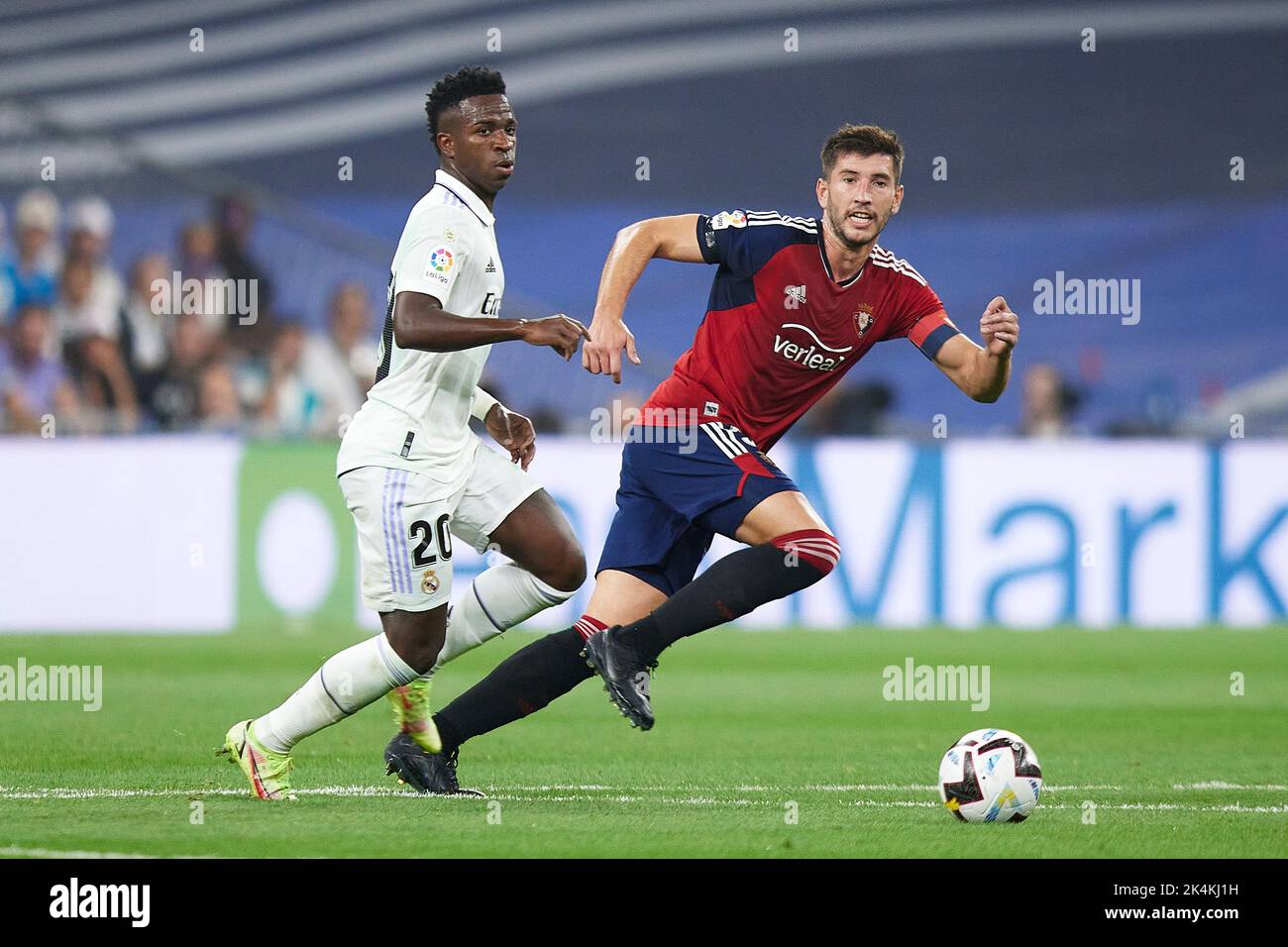 Vinicius Jr. of Real Madrid and David Garcia of CA Osasuna during the ...