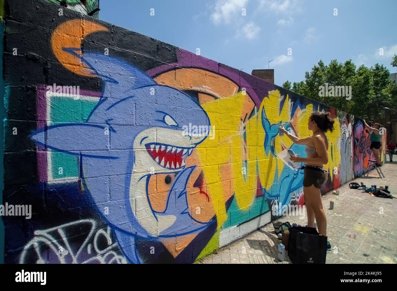 free painted women street art, woman in shorts and long hair, painting ...