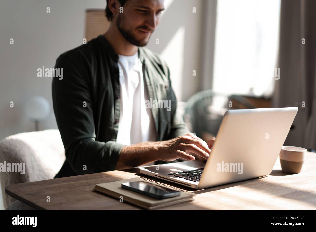 Male remote working from home and having work confrence video call ...