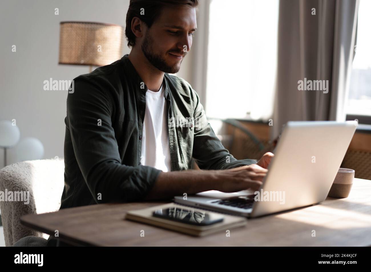 Male remote working from home and having work confrence video call ...