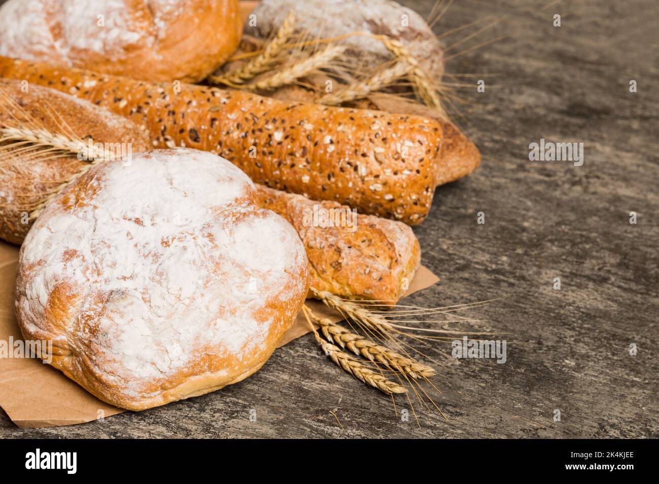Homemade natural breads. Different kinds of fresh bread as background ...