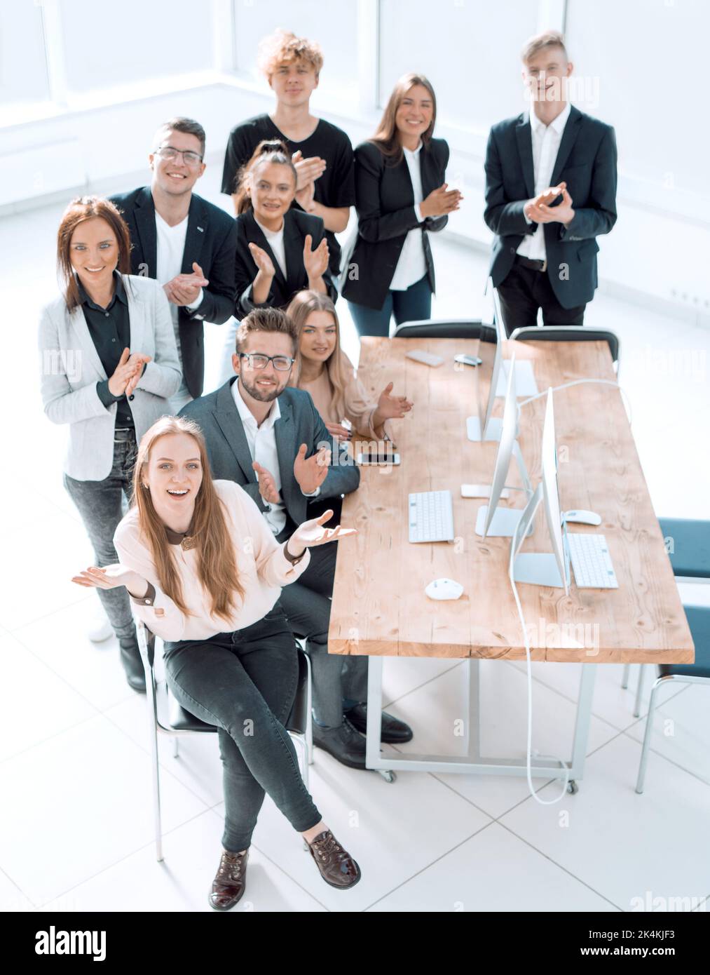 top view. a group of happy employees in the workplace Stock Photo - Alamy