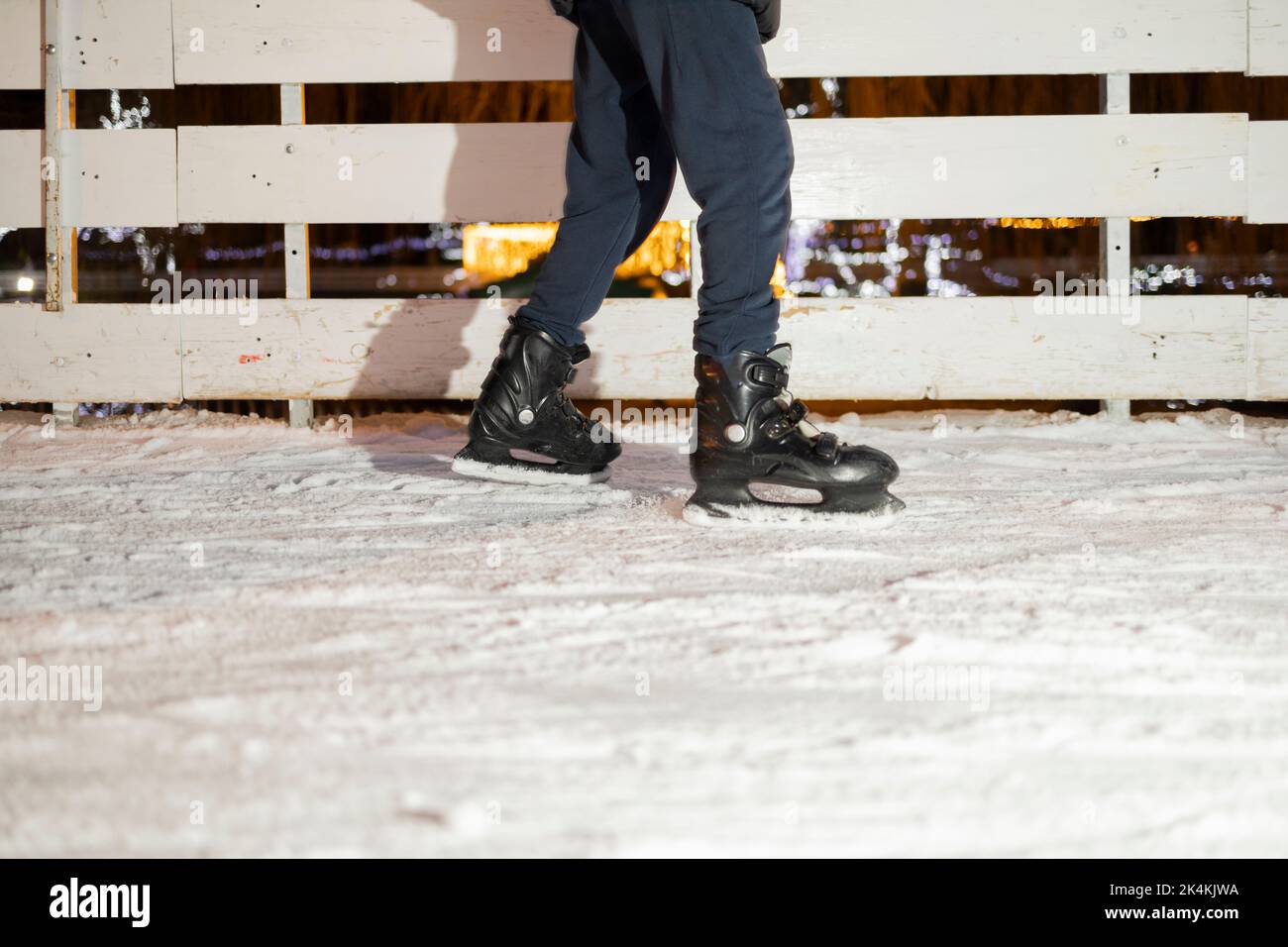 Male legs in black ice skates Stock Photo - Alamy