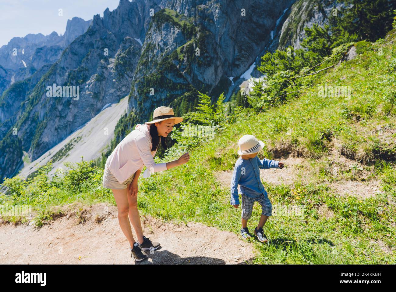 A female and a child trekking on Austrian alps. It was Gosau in upper ...