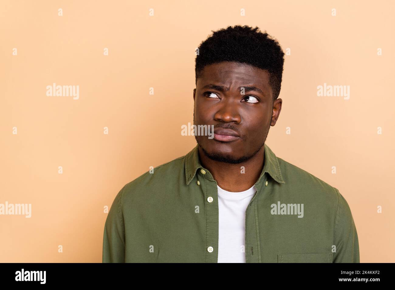 Photo of unsure guy look empty space decide solution mind isolated on ...