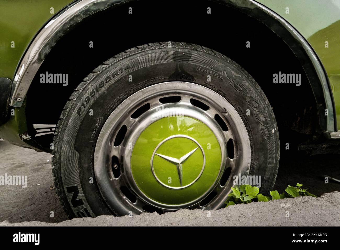 Close-up of an old Mercedes tire with green color in the center Stock ...