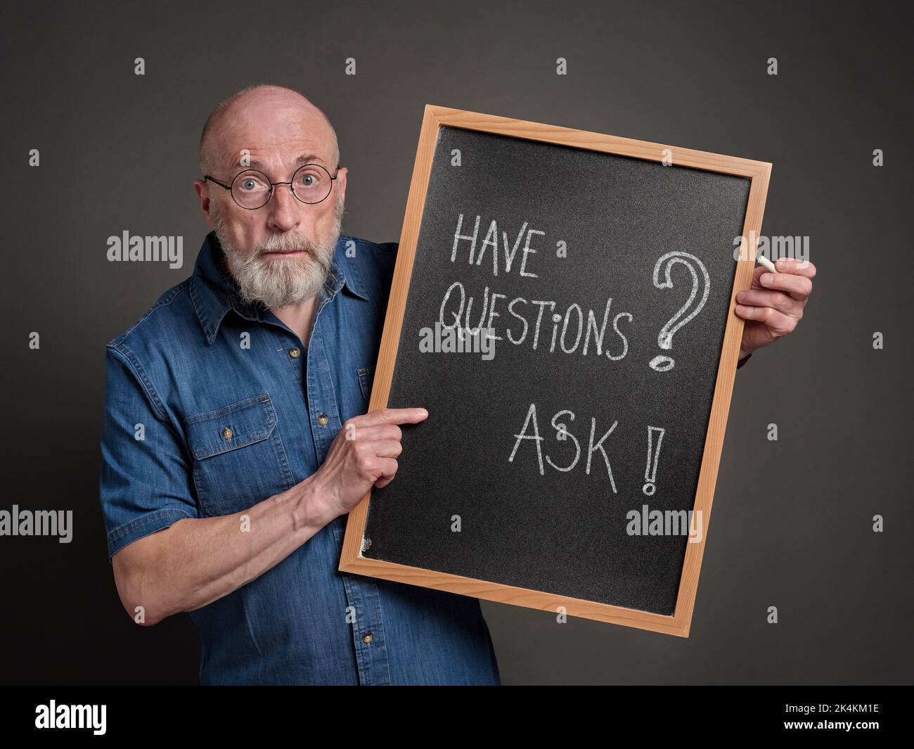 Have questions? Ask! Senior man, teacher, mentor or presenter, with a ...