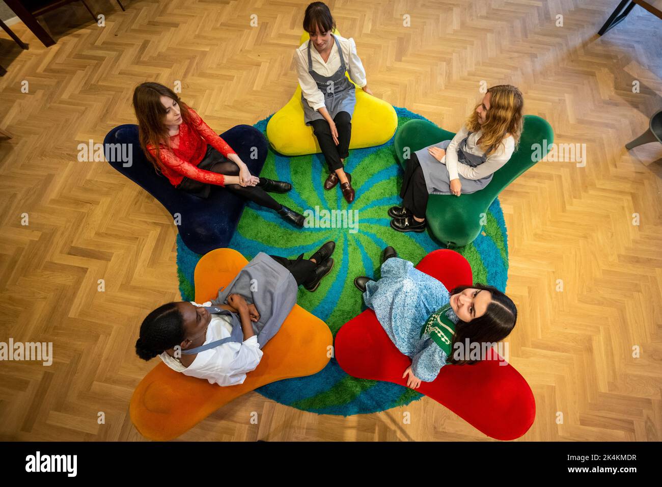 London, UK. 3 October 2022. Staff members sit on a 'Group of five ...