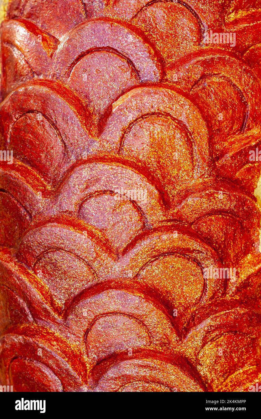 Red golden clay scales overlapping each other on the decorative dragon ...