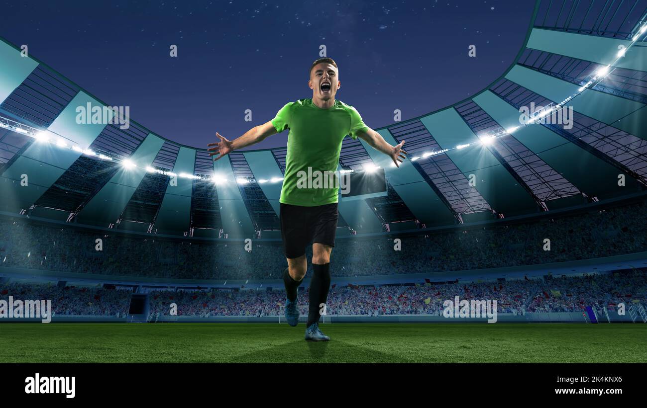 Winner emotions. Excited soccer player running at the crowded stadium ...
