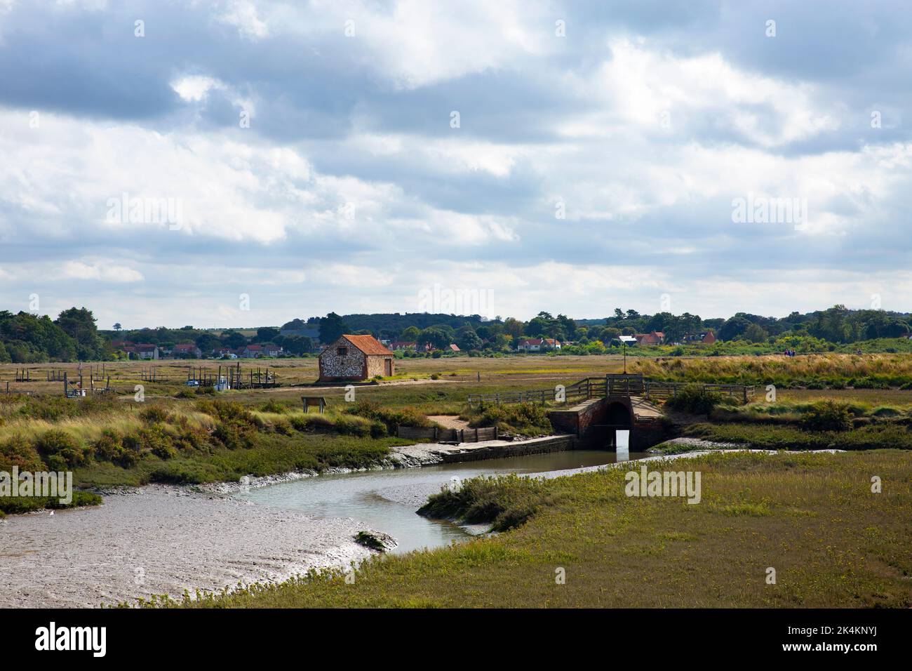 Coal barn and sluice gate at the Old Harbour on tidal estuary at ...