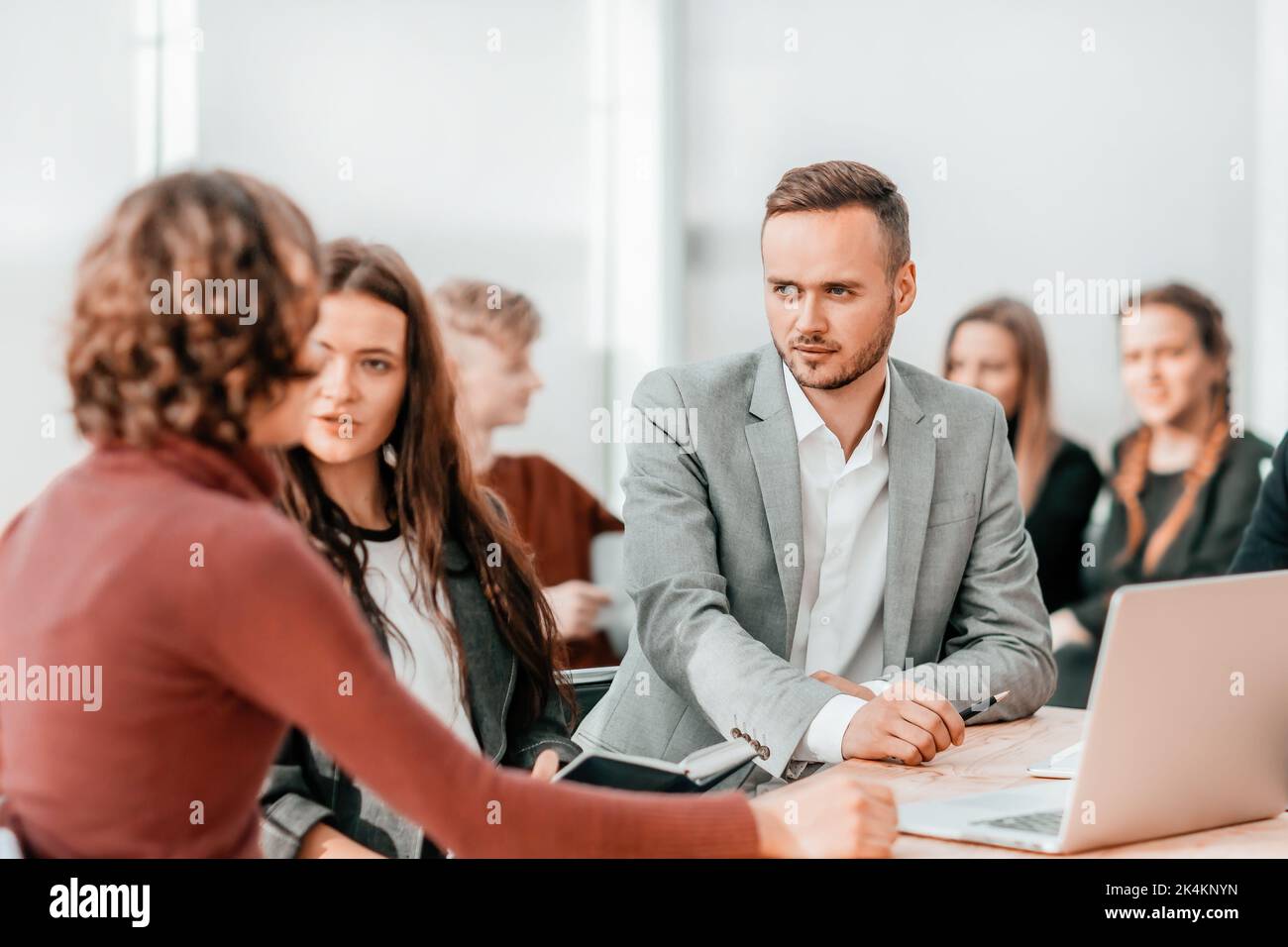 young entrepreneur discussing working issues with his employees Stock ...